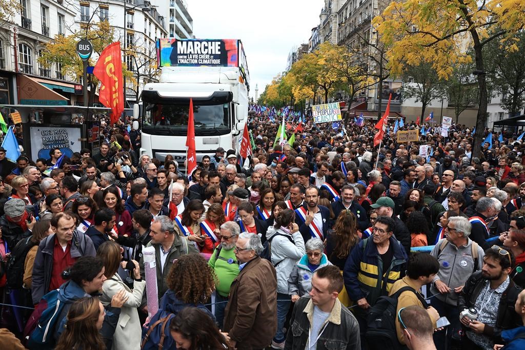 Thousands march in Paris against rising cost of living, climate ...