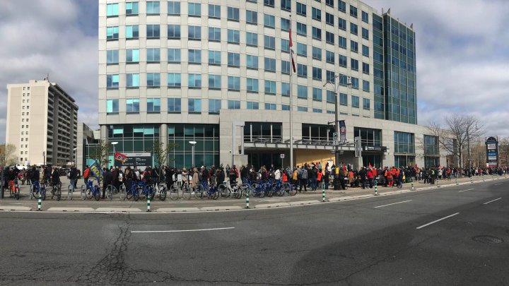 Hundreds of public servants, supporters picket outside federal building ...