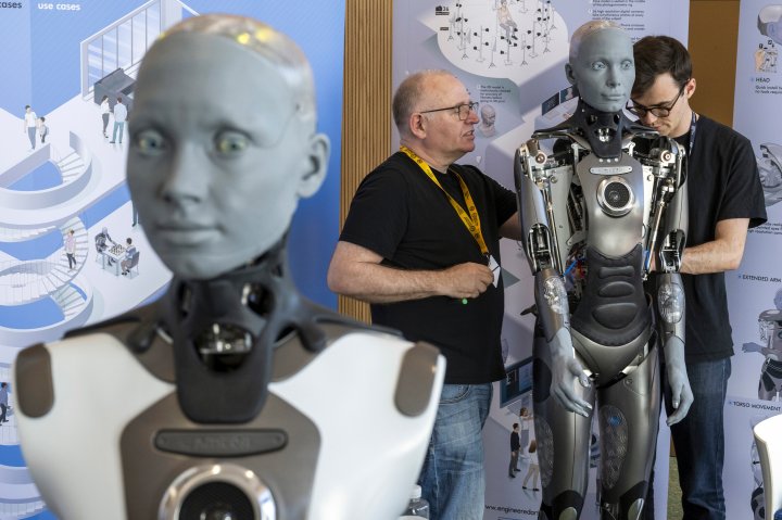 Robots say they won’t rebel against humans as dozens gather at ...