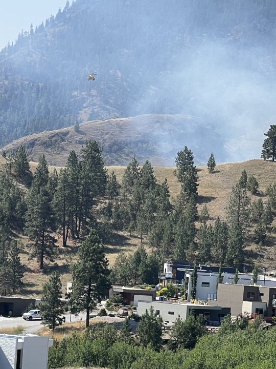 Spot fire in hills above Skaha Lake visible to residents - Okanagan ...