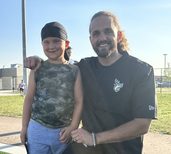 Football-loving kid and former Edmonton Elks player lean on each other ...