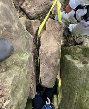 Woman wedged upside down between rocks for 7 hours while retrieving ...