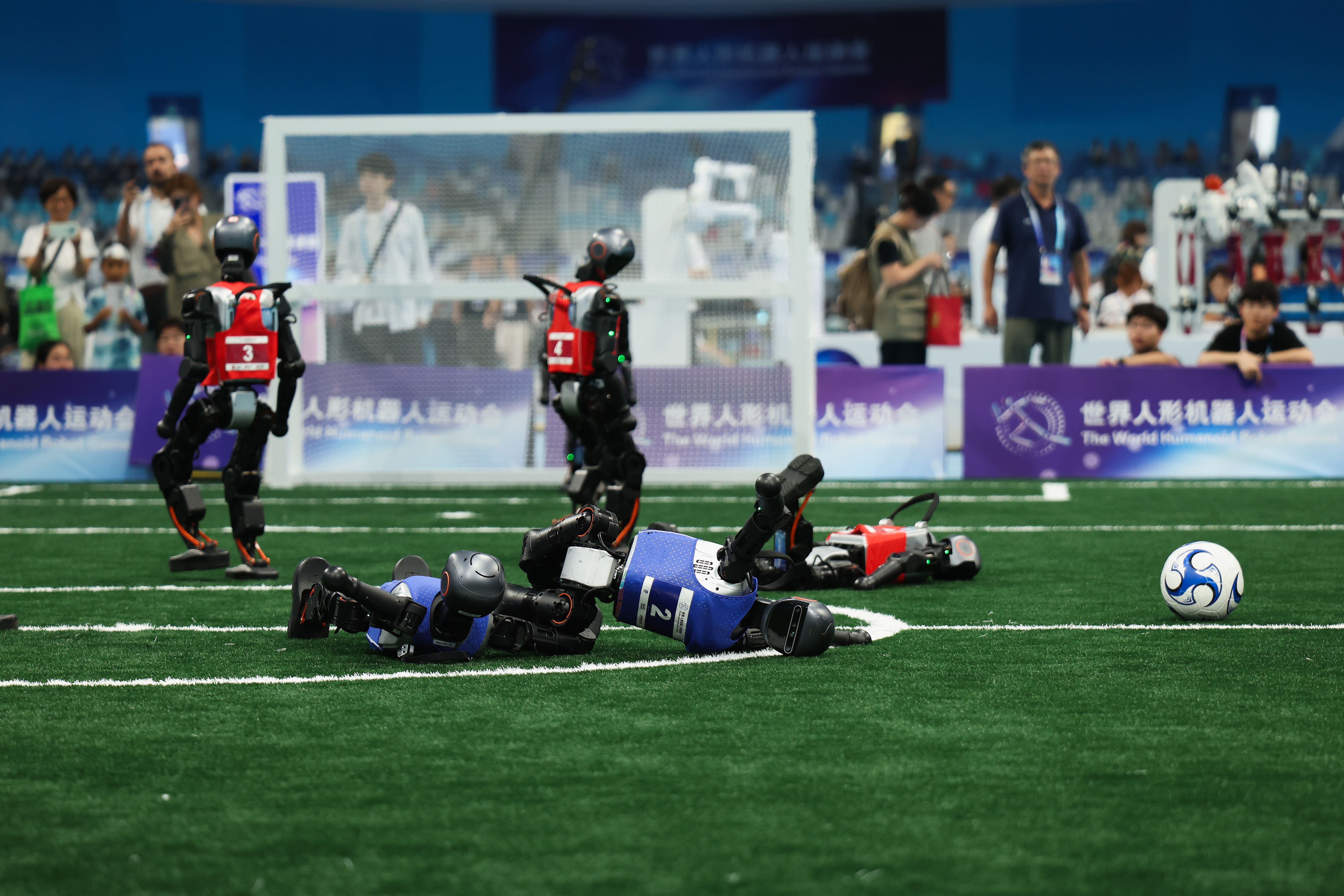 Robots box, sprint and stumble in first-ever World Humanoid Robot Games ...