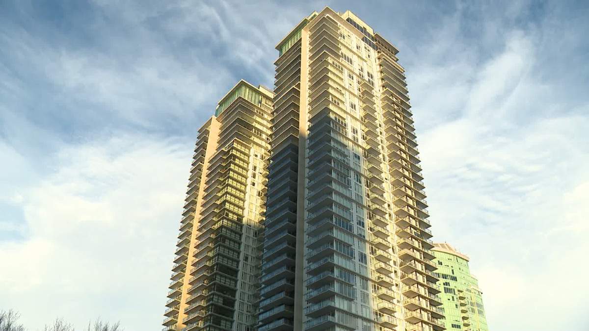 Calgary woman charged after tossing traffic cone off downtown apartment ...